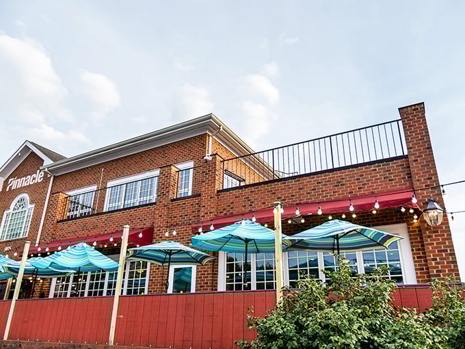 The brick exterior of Nantucket Grill welcomes you with its cheerful red accents and turquoise umbrellas&mdash;New England charm with a Carolina twist.