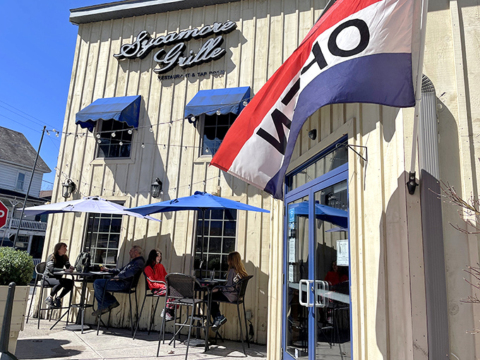 The beige exterior with blue awnings beckons like an old friend. Outdoor seating perfect for people-watching while savoring that first bite of heaven.