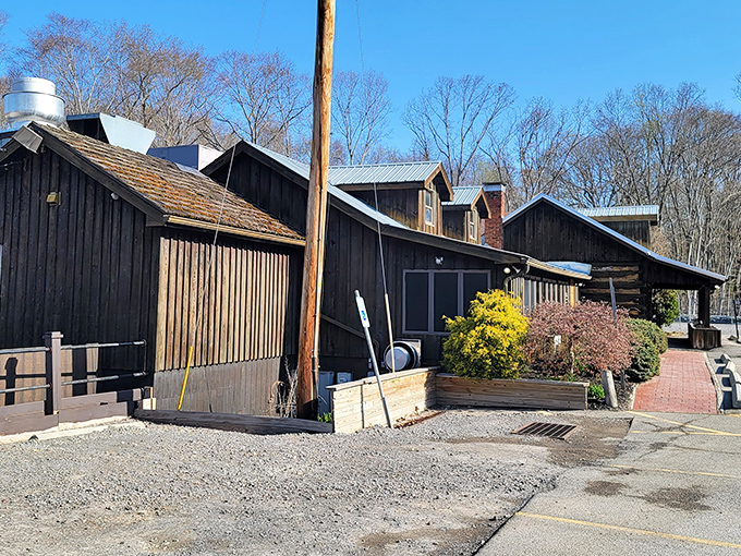 The rustic exterior of Log Cabin Inn isn't just Instagram-worthy&mdash;it's a time capsule of Pennsylvania charm nestled among seasonal plantings and welcoming pathways.