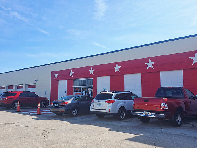 America's Antique Mall announces itself with patriotic flair, its red exterior and white stars promising a star-spangled journey through America's collective attic.