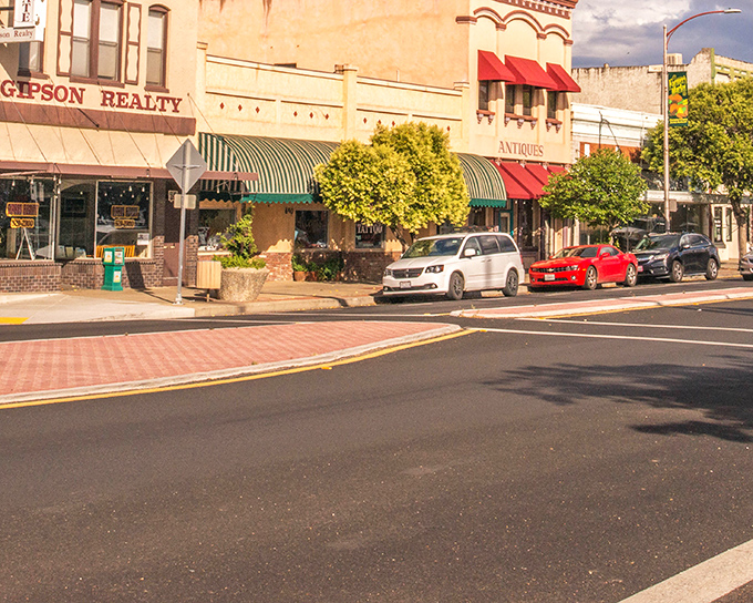 Historic storefronts line Red Bluff's Main Street, where awnings in green and red create a timeless small-town tableau that Norman Rockwell would have appreciated.