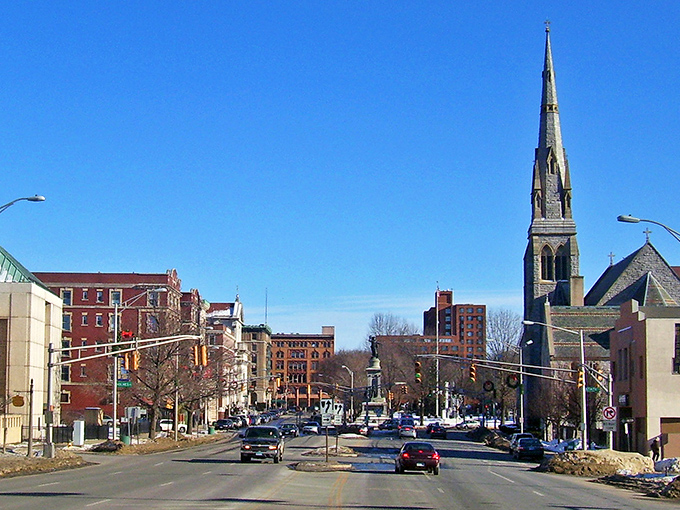 Waterbury's downtown skyline greets visitors with its iconic church spire reaching toward impossibly blue skies, a postcard-perfect introduction to the Brass City's architectural character.