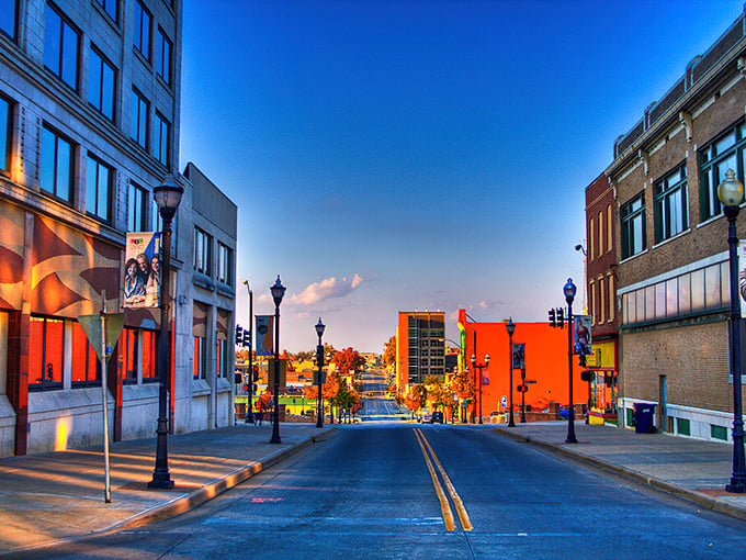 Downtown Springfield at dusk transforms into a painting of warm hues and long shadows, like an Edward Hopper scene with Midwestern charm.