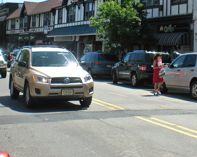 Tudor-style storefronts welcome shoppers along Montclair's bustling commercial districts. Even the parking spots look inviting!