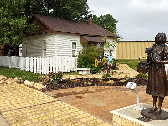 The iconic farmhouse stands proudly alongside the yellow brick road, complete with Dorothy's statue keeping watch. Kansas magic in its purest form.