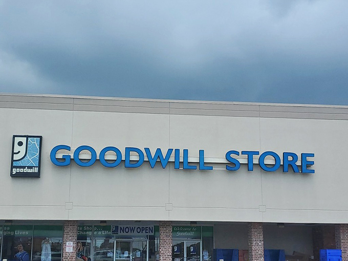 The iconic blue Goodwill sign stands proud against Louisiana's sky, beckoning bargain hunters like a lighthouse guiding ships to the shores of affordability.