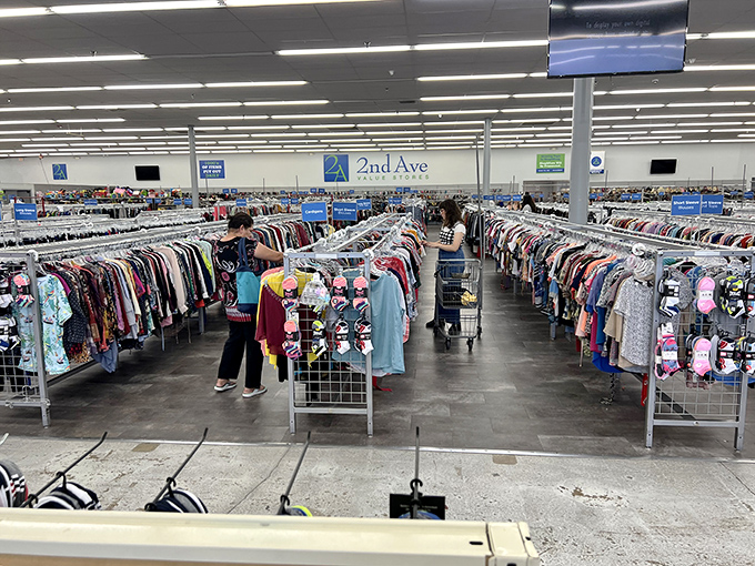 Endless racks of possibility stretch across 2nd Ave's clothing ocean, where treasure hunters navigate a sea of secondhand fashion finds.