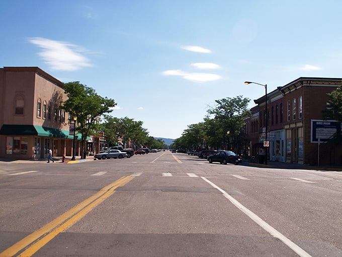 Main Street stretches toward the mountains like nature's welcome mat, offering that perfect small-town vibe where rush hour means three cars at a stop sign.