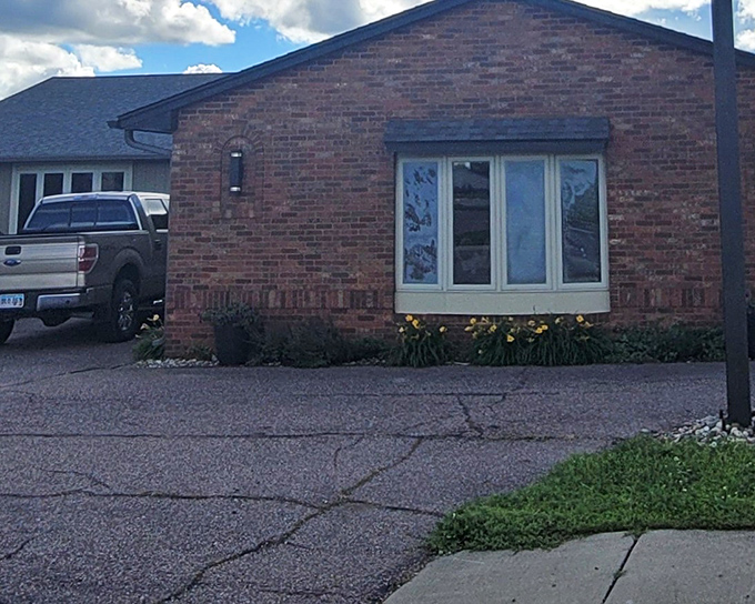 The unassuming brick exterior of Hartford Steak Co. Tavern proves once again that the best culinary treasures often hide in plain sight.