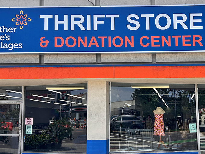 The blue and orange storefront beckons like a treasure chest waiting to be opened. Bargain hunters, your paradise awaits!