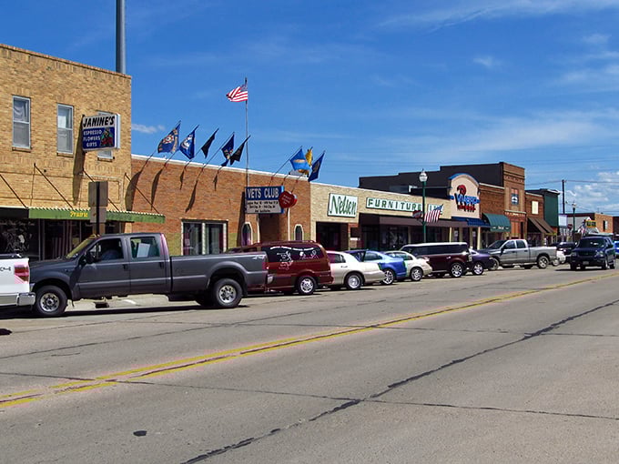 Downtown Valentine showcases classic Americana charm with its brick buildings, fluttering flags, and storefronts that whisper tales of the heartland.