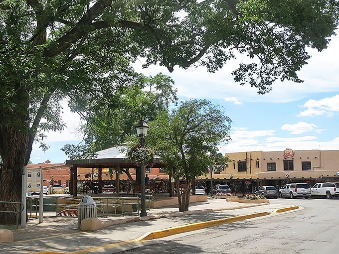 Adobe architecture isn't just practical—it's poetry in earthen form. Taos' historic buildings stand like sentinels against that impossibly blue New Mexico sky.