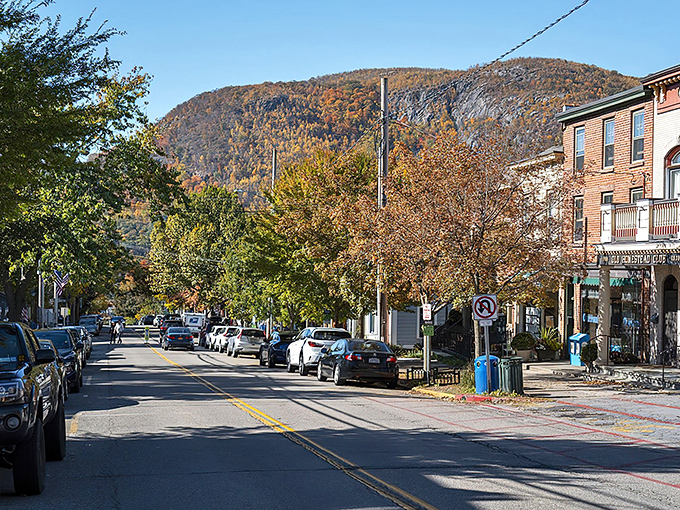 Main Street meets mountain majesty in Cold Spring, where fall foliage creates a backdrop that makes even smartphone photos look professional-grade.