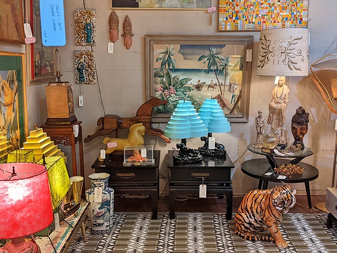 A treasure hunter's dream corner where mid-century lamps illuminate tiger figurines and Asian-inspired decor. Every inch tells a different story.