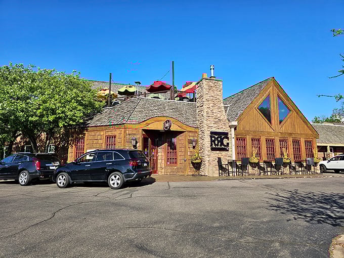 The rustic stone and timber exterior of Rudy's Redeye Grill beckons like a cozy cabin retreat, promising warmth and deliciousness within its walls.