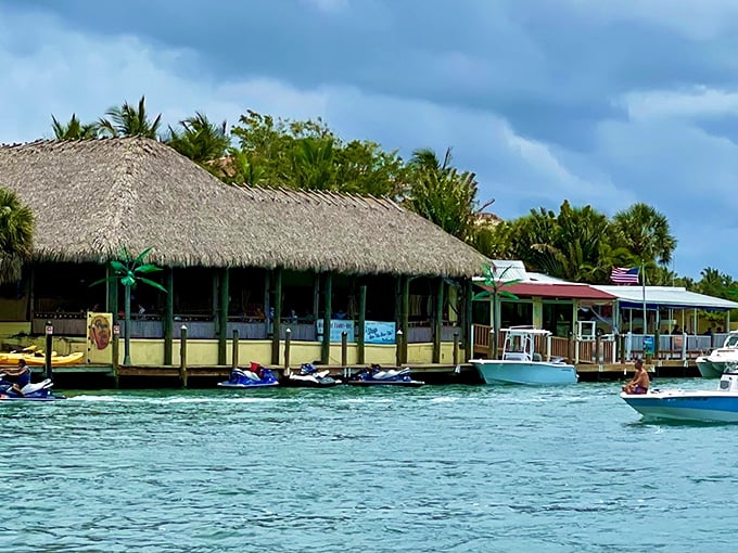Paradise found! Pop's iconic thatched roof tiki hut beckons from the Intracoastal Waterway, promising cold drinks and fresh seafood with a side of Florida magic.