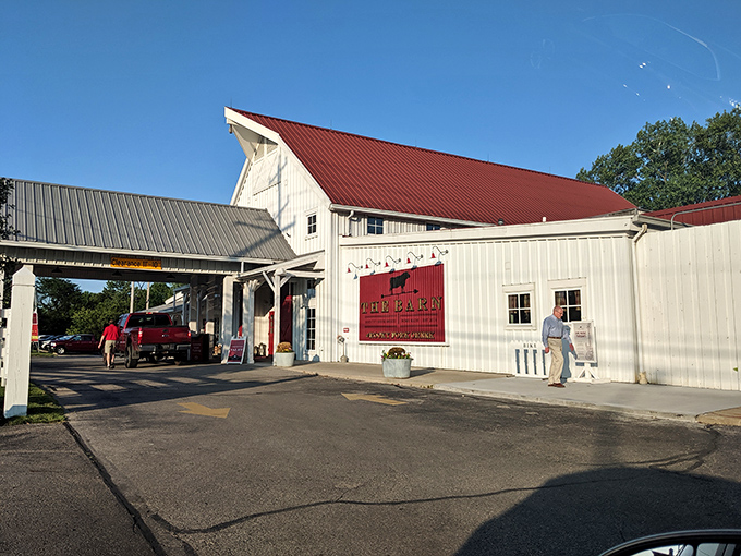 That iconic red accent wall with the silhouette of a cow tells you everything you need to know—this place takes its meat seriously. The barn lights add just the right touch of farmhouse chic.