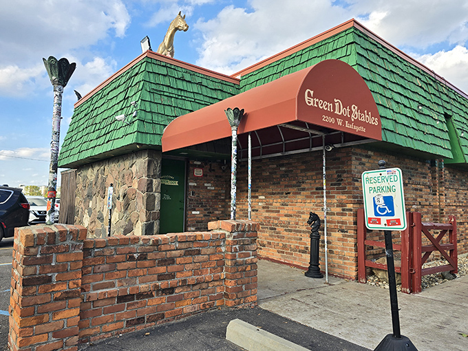 The emerald kingdom awaits! Green Dot Stables' distinctive roof and golden horse statue stand as beacons to hungry Detroit slider enthusiasts.