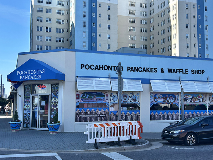 The iconic blue awning of Pocahontas Pancake House stands out against Virginia Beach's skyline, beckoning breakfast enthusiasts like a pancake lighthouse.