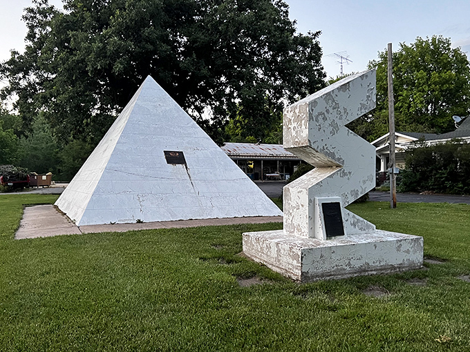 This weathered sculpture adds an unexpected artistic flourish, proving that even time capsules need a little geometric pizzazz.