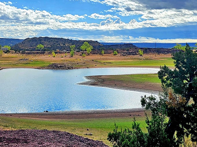 The shimmering waters of Lyman Lake create nature's mirror, reflecting Arizona's big sky country in spectacular fashion.
