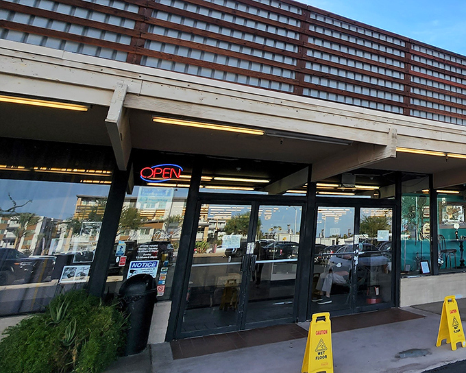 The unassuming exterior of Antique Trove beckons with that glowing "OPEN" sign &ndash; the universal symbol for "come spend money you didn't plan to spend."