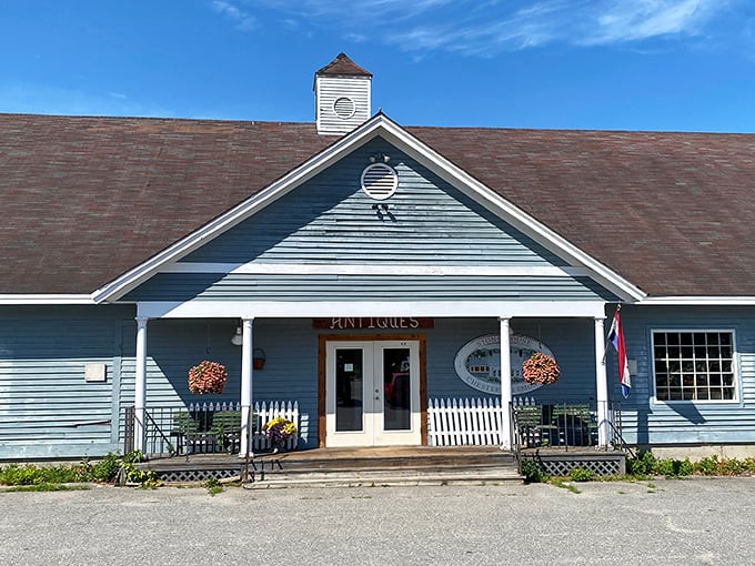 The charming blue exterior welcomes treasure hunters with classic New England architecture that promises adventures inside.