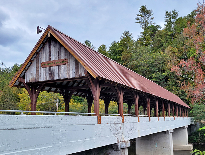 The Townsend/Sunshine Covered Bridge stands like a rustic time portal, its weathered wood and copper-toned roof creating a perfect Tennessee postcard moment.