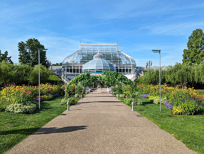 The grand entrance to Phipps Conservatory looks like nature's version of a palace. Victorian glass architecture meets vibrant gardens in a combo that screams "your houseplants are judging you now."
