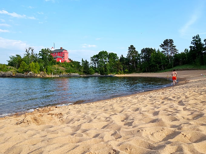 The iconic red Marquette Harbor Lighthouse stands sentinel over McCarty's Cove, where golden sands meet Lake Superior's crystal waters&mdash;Michigan's answer to the Mediterranean, minus the passport requirements. 