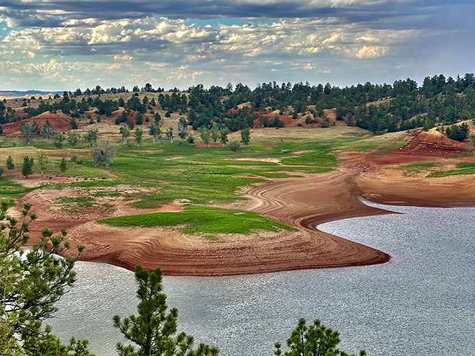 Mother Nature showing off her color palette where rusty red cliffs meet crystal blue waters. Wyoming's version of a beach vacation, minus the crowds and jellyfish.