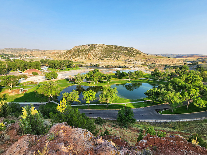 A bird's-eye view of paradise! Hot Springs State Park unfolds like nature's own resort, complete with emerald waters and rugged Wyoming terrain stretching to the horizon.