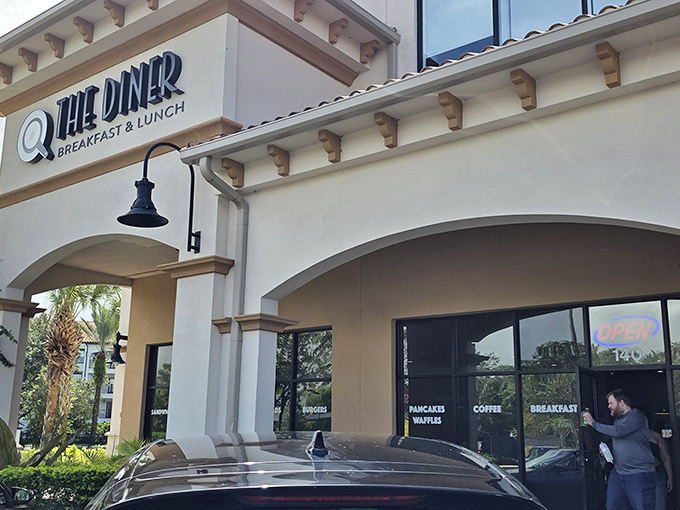 The Mediterranean-inspired exterior of @The Diner promises culinary treasures within, like finding a secret breakfast oasis in Orlando's bustling landscape.