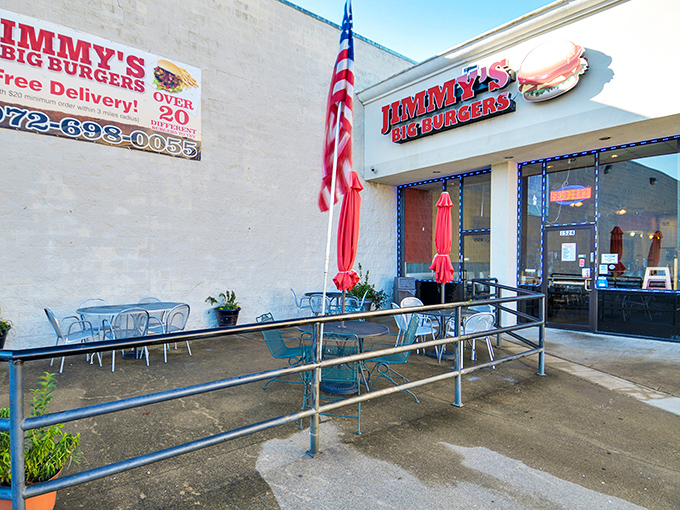 An American flag waves proudly outside Jimmy's, where patriotism pairs perfectly with hand-crafted burgers and hometown pride.