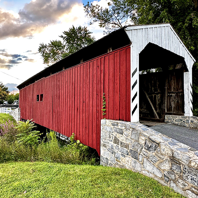 The classic red siding against white portals creates that perfect "you've arrived somewhere special" moment. Pennsylvania's architectural poetry in wooden form.
