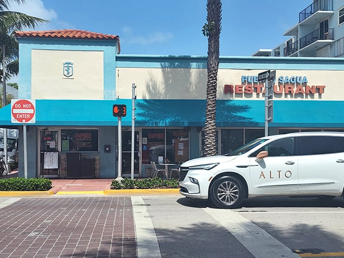 The blue awning beckons like a tropical oasis amid South Beach's glitz. Puerto Sagua's modest exterior hides culinary treasures that have outlasted countless trendy neighbors.