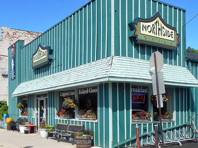 The iconic teal exterior of Northside Grill stands as Ann Arbor's breakfast beacon, where morning magic happens daily and flower baskets welcome hungry patrons year-round.