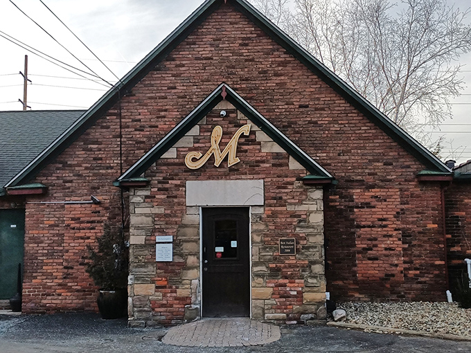 The iconic "M" glows like a beacon of culinary promise above Michaelangelo's rustic stone and brick exterior, Cleveland's answer to Tuscan charm.