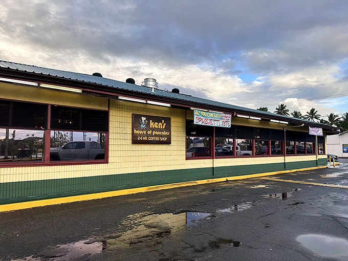 The yellow and green exterior of Ken's House of Pancakes stands as a beacon of comfort food in Hilo, promising pancake paradise for hungry travelers and locals alike.