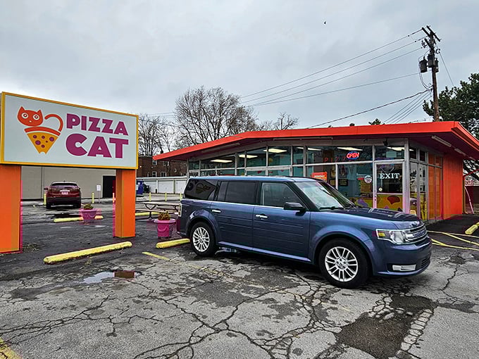 The bright orange exterior with its distinctive signage stands out like a culinary lighthouse, beckoning hungry pizza seekers from across Toledo.