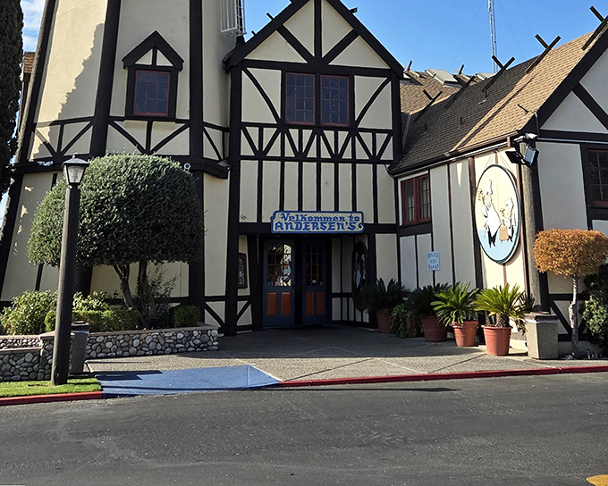 The iconic Tudor-style facade of Pea Soup Andersen's stands like a Danish fairytale dropped into California's highway landscape, promising comfort and nostalgia inside.