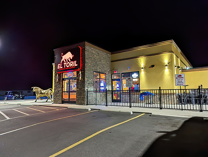 El Toril glows like a beacon in the night, its golden exterior and distinctive red bull sign promising Mexican flavors worth the journey.