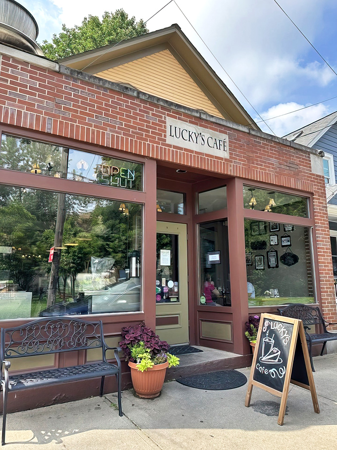 The welcoming entrance sets the tone - unpretentious yet charming, with potted plants and a simple chalkboard sign that says "come on in, we've been expecting you."