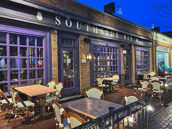 As twilight falls, Southside 815 transforms into a cozy urban oasis. The distinctive purple-trimmed windows glow invitingly, promising Southern comfort food that'll make your taste buds stand up and salute.