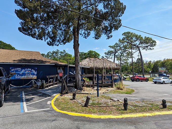 The unassuming exterior of Dan's Clam Stand proves once again that Florida's best seafood treasures often hide in plain sight, complete with that essential tiki-roof charm.