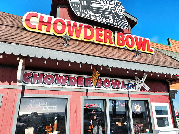 The Chowder Bowl's iconic train logo and vibrant signage stand out against the blue Oregon sky like a beacon for hungry coastal travelers.