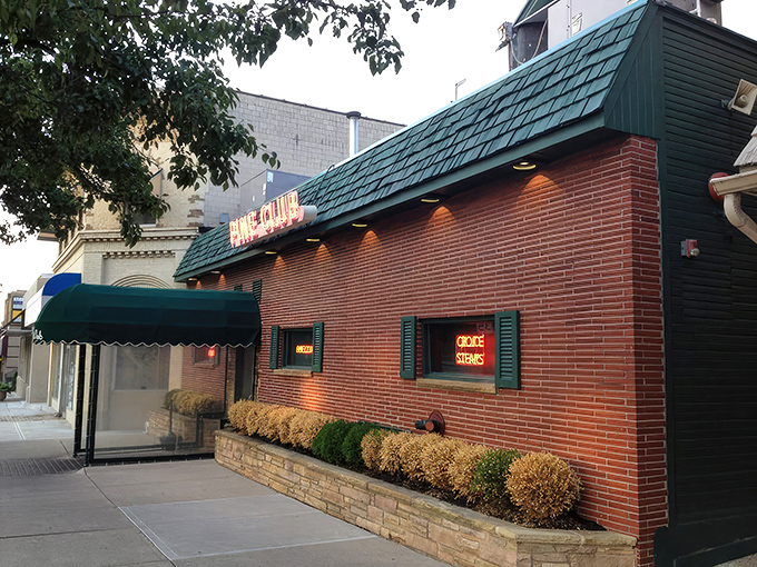 The neon glow of Pine Club's sign has been beckoning hungry Daytonians for decades, a red-lit promise of carnivorous delights within.