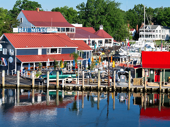 Harbor perfection: The iconic red roofs of St. Michaels' waterfront buildings reflect in the Miles River like a maritime postcard come to life.