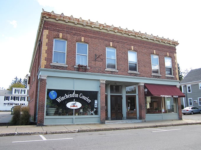 Historic brick buildings like the Winchendon Courier office stand as charming sentinels of small-town life, where news travels at the perfect unhurried pace.
