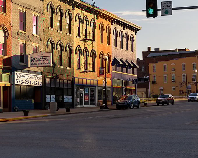 Golden hour bathes Hannibal's historic buildings in warm light, transforming ordinary storefronts into a Norman Rockwell painting come to life.